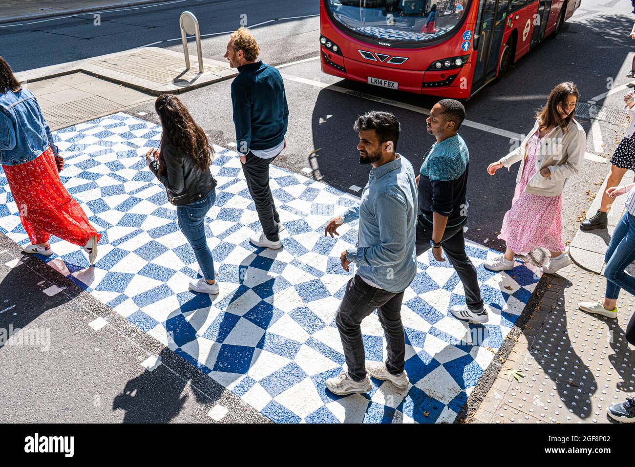 KENSINGTON LONDON, UK. 23 August 2021. Pedestrians using a creative ...
