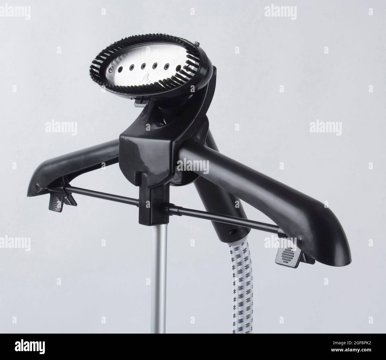 Steamer for clothes on the hanger isolated on white background Stock ...