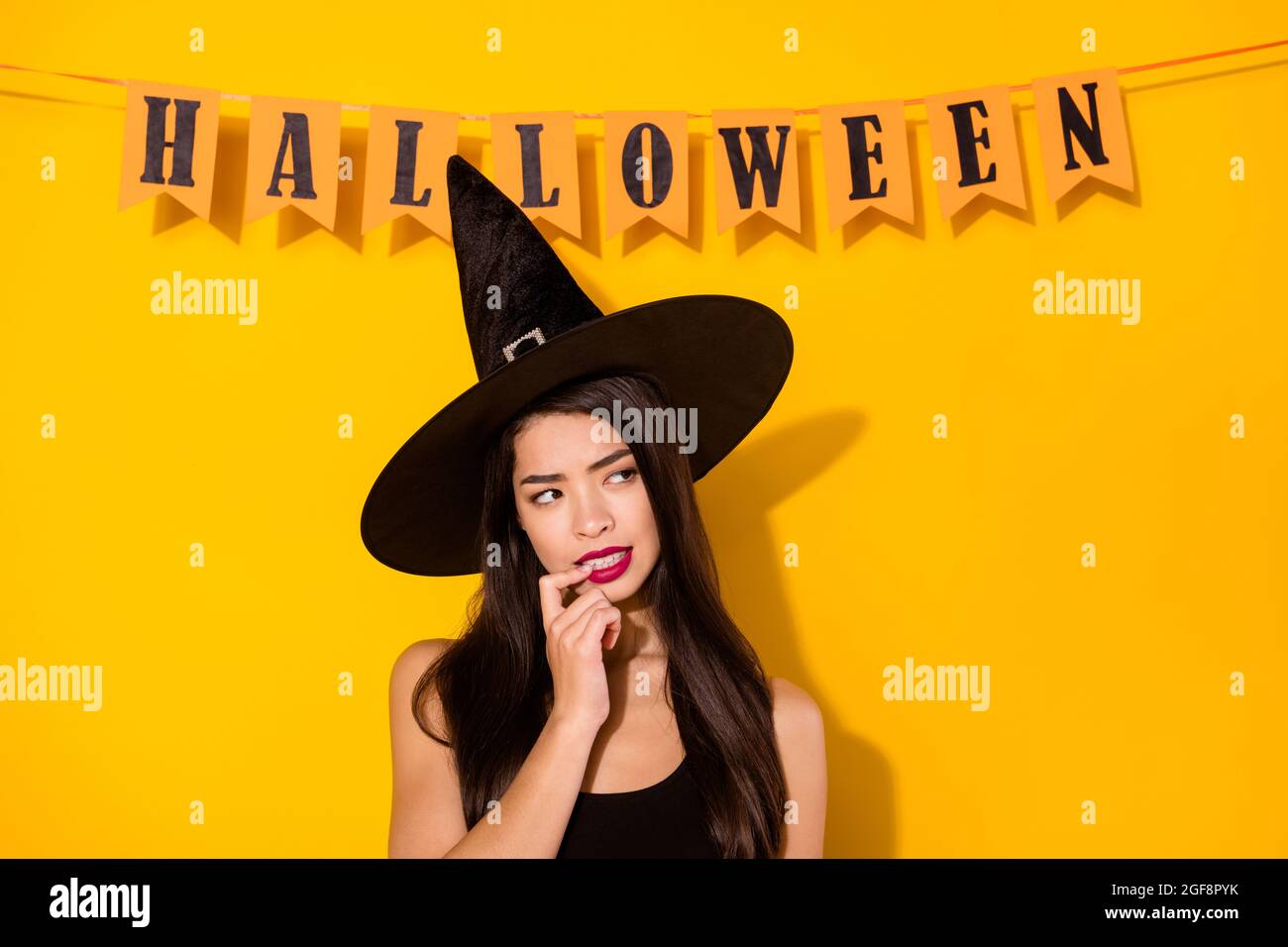 Photo of strict witch young lady finger mouth with decoration look ...