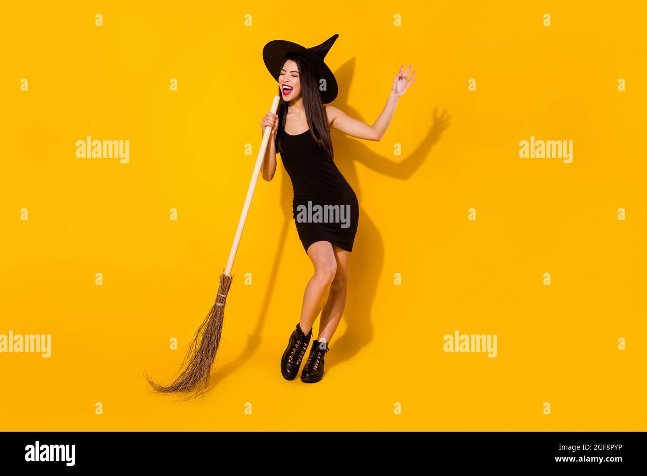 Full body photo of sing witch young lady with broom wear black dress ...