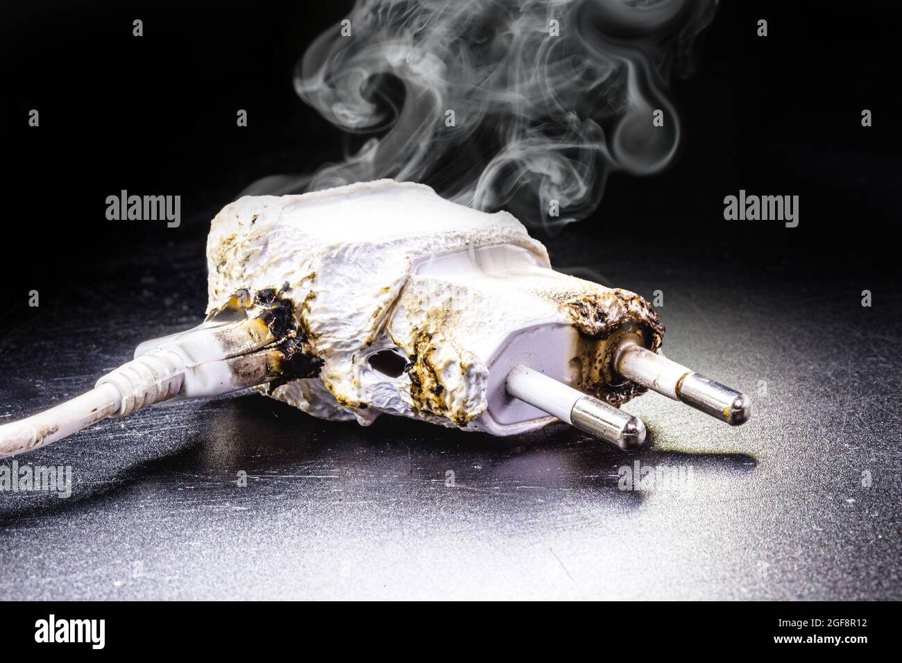 broken smartphone charger, charred after short circuit Stock Photo - Alamy