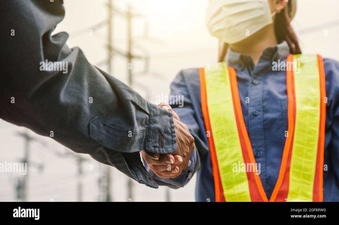 Closeup shake hand teamwork engineer on site work success , Hand shake ...