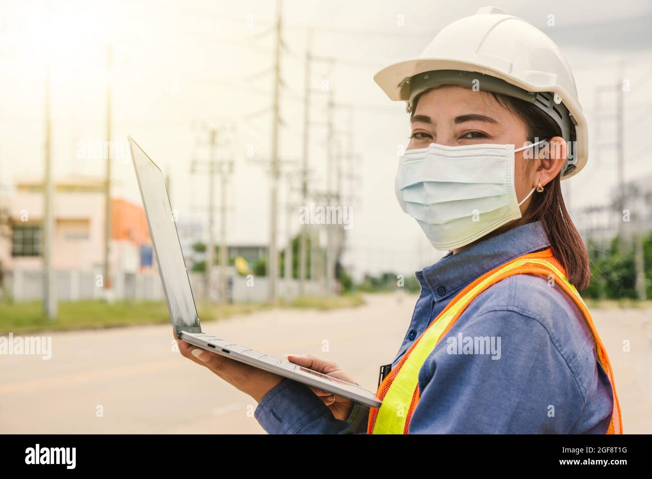 Women Electricity Engineer Working on site service with computer Stock ...
