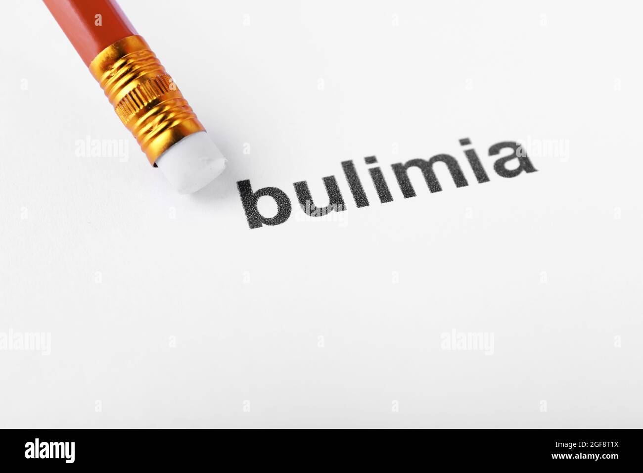 Bulimia word with pencil eraser on white paper background Stock Photo ...