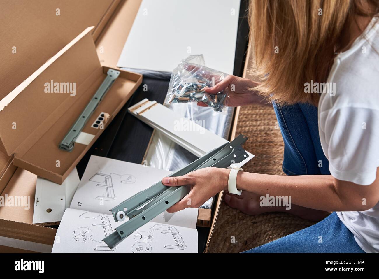 Woman reading an instruction manual hi-res stock photography and images ...