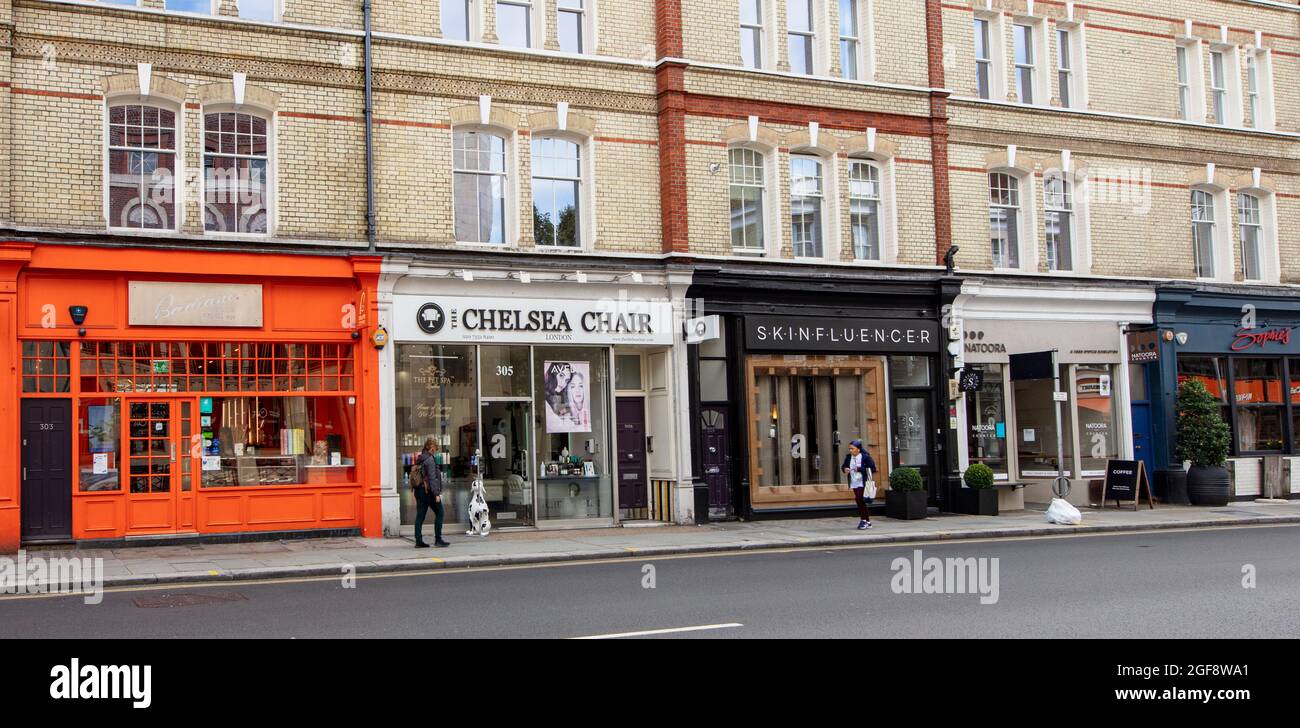 Upmarket storefronts on the Fulham Road, London, an area popular with ...