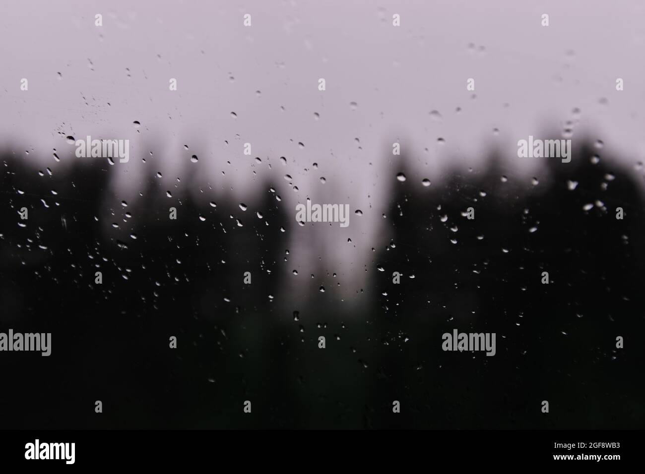 Moody view of mountain landscape through a wet window after rain Stock ...