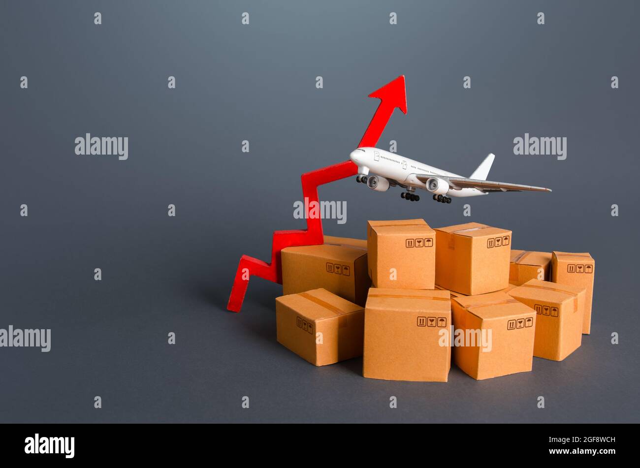Cargo airplane above boxes and up arrow. Growth of tariffs for the ...