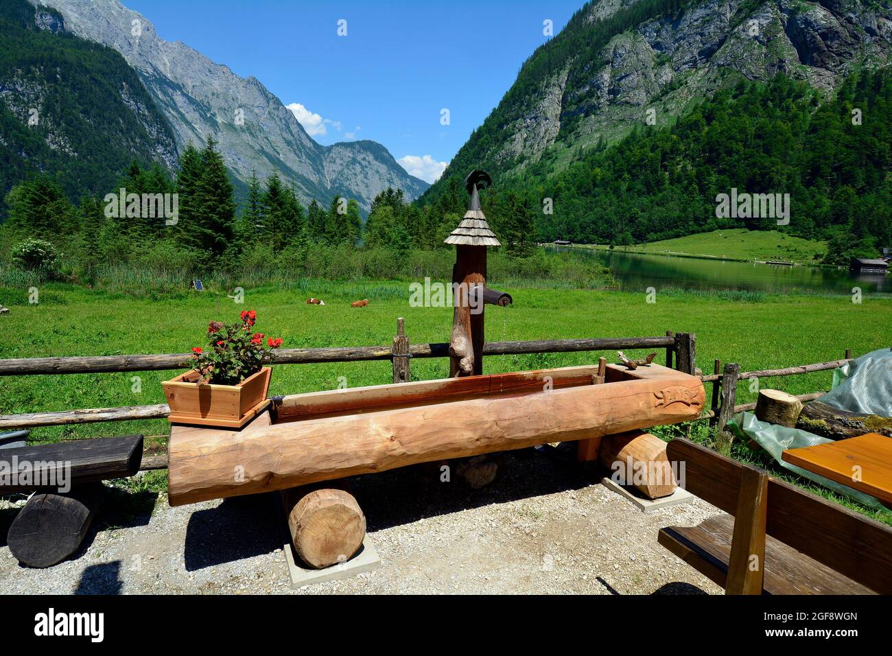 Germany; Bavaria; fountain for drinking water with wooden trough at ...