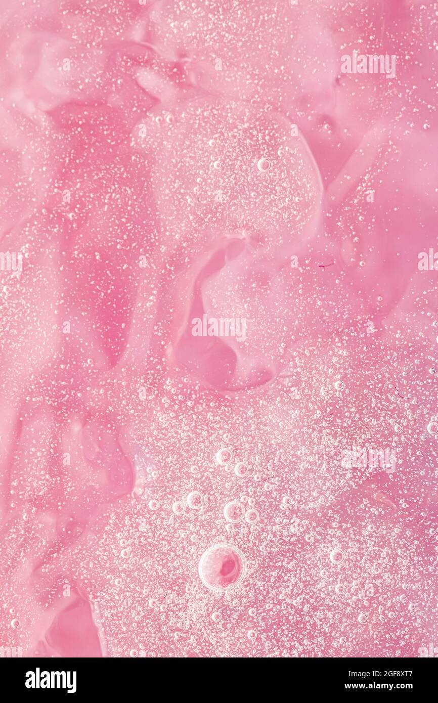 Abstract pink liquid background, paint splash, swirl pattern and water ...