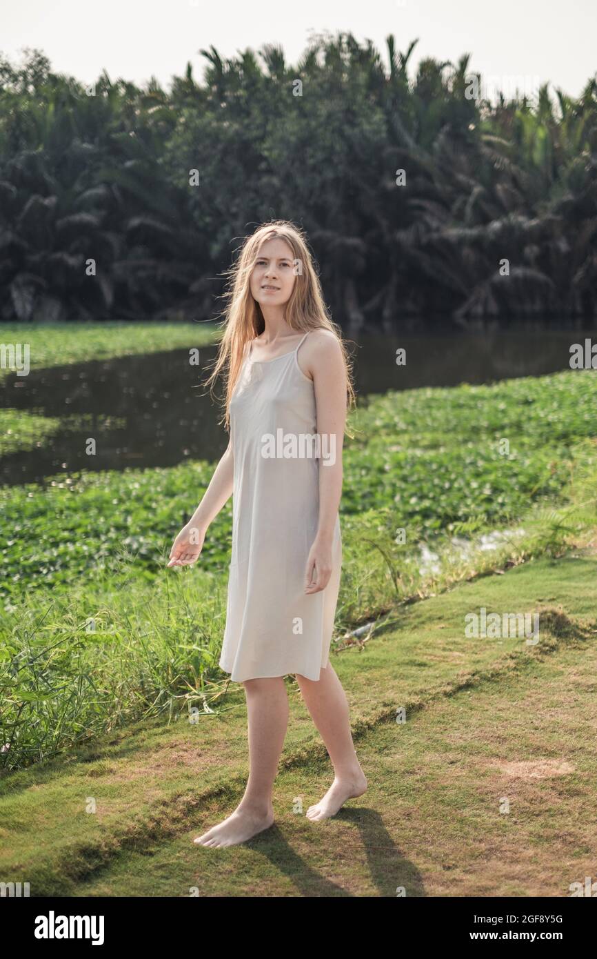 Woman walking barefoot park hi-res stock photography and images - Alamy