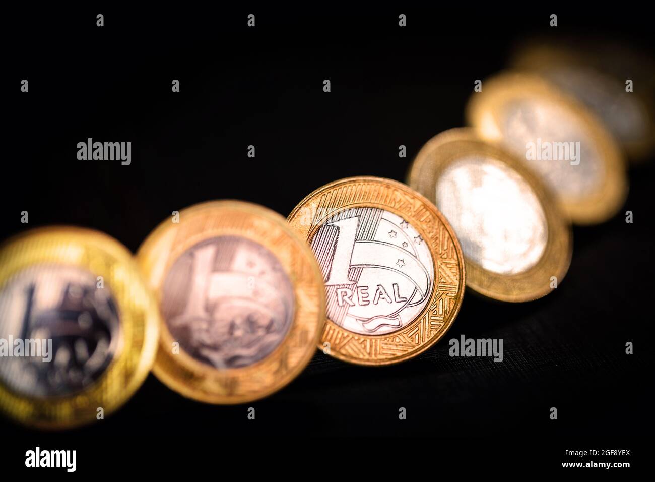 images of one real coins, money from brazil on isolated black ...