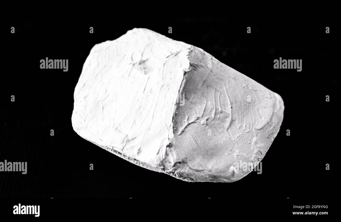 Kaolin on isolated black background, is an inorganic mineral ...