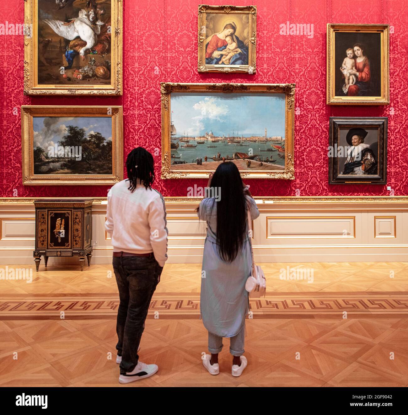 Museum-goers looking at Canaletto in The Wallace Collection, Hertford ...