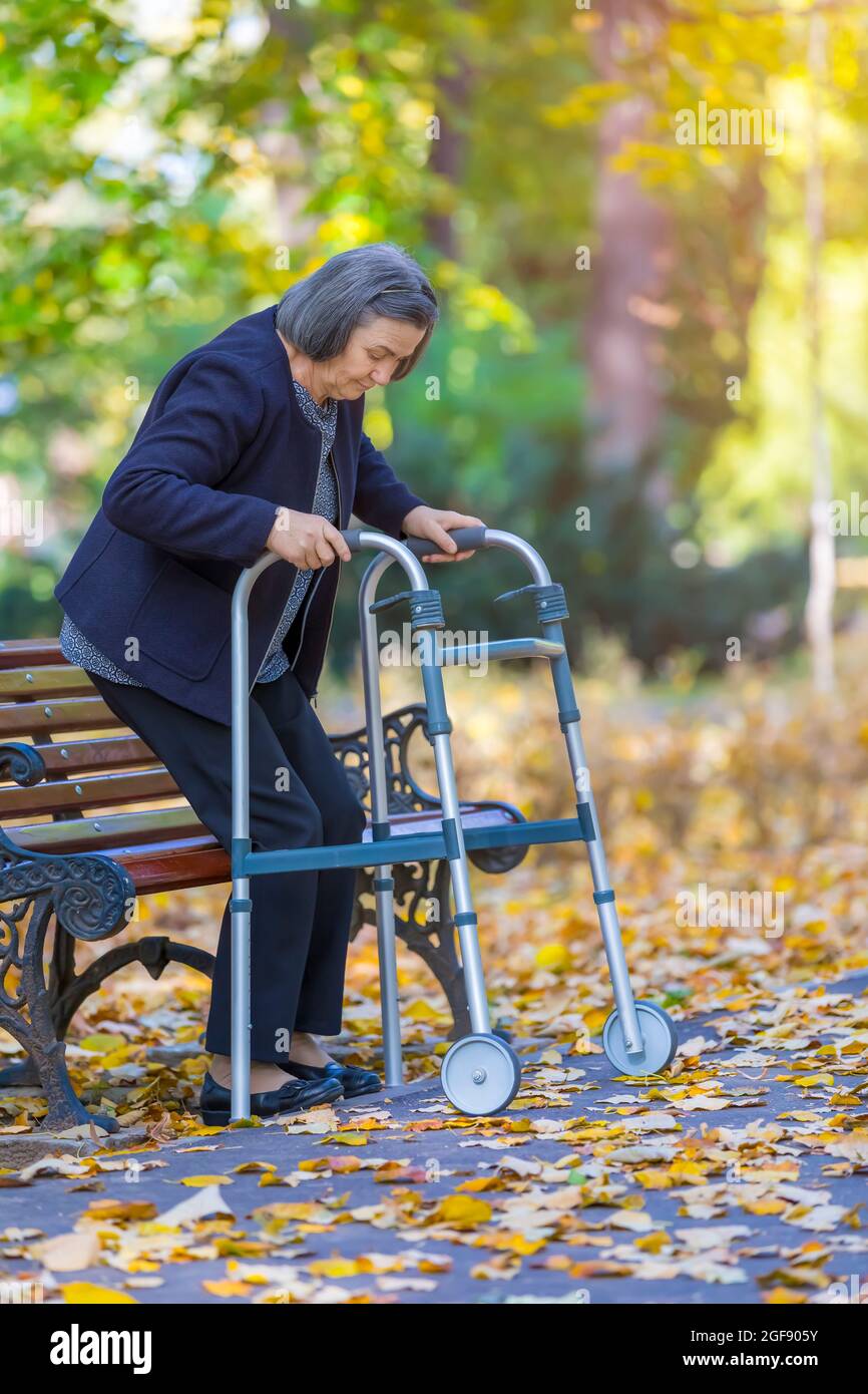 Old lady walker hi-res stock photography and images - Alamy