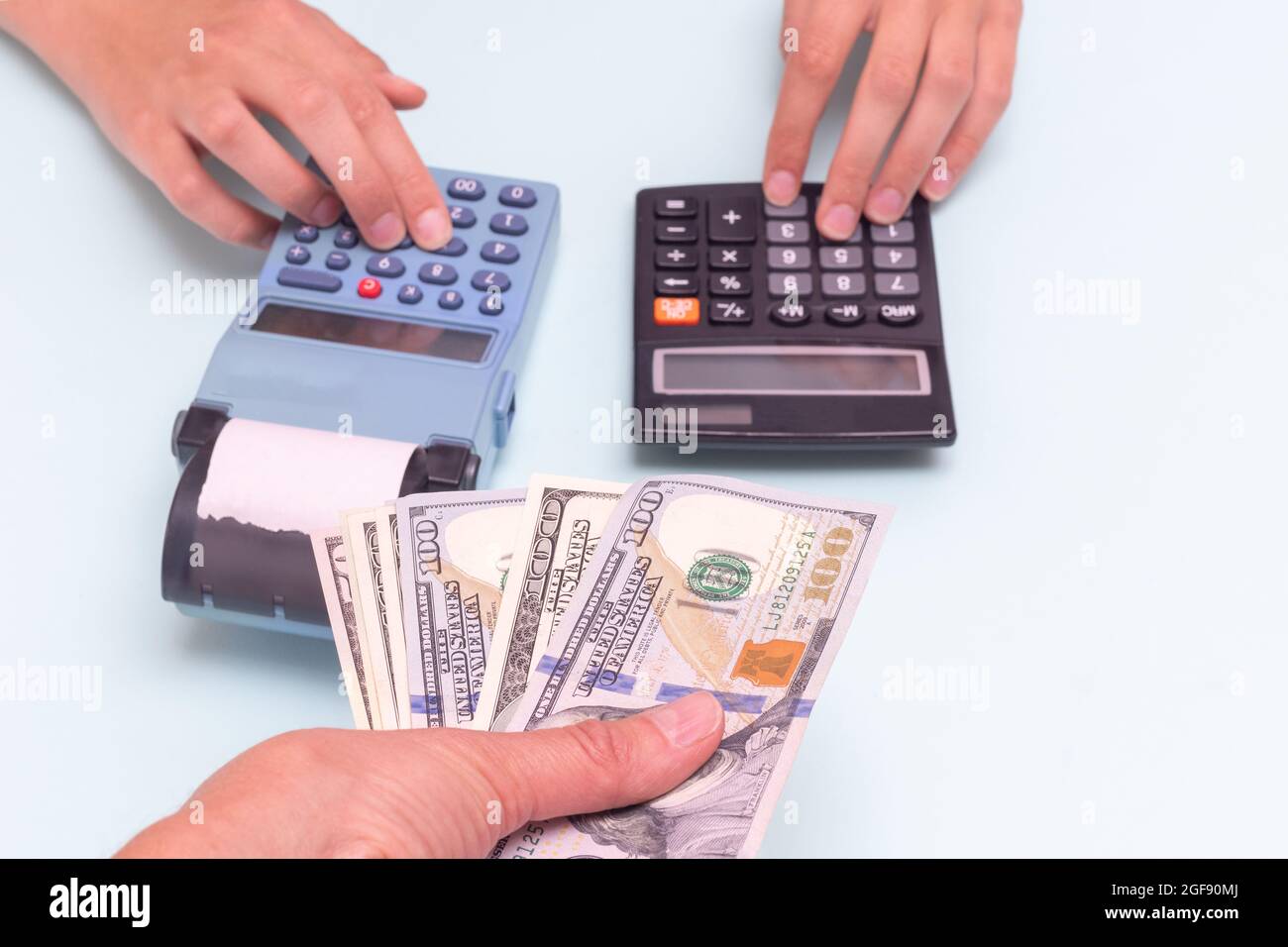 Payment for purchases in cash. A hand giving cash for a purchase, a ...