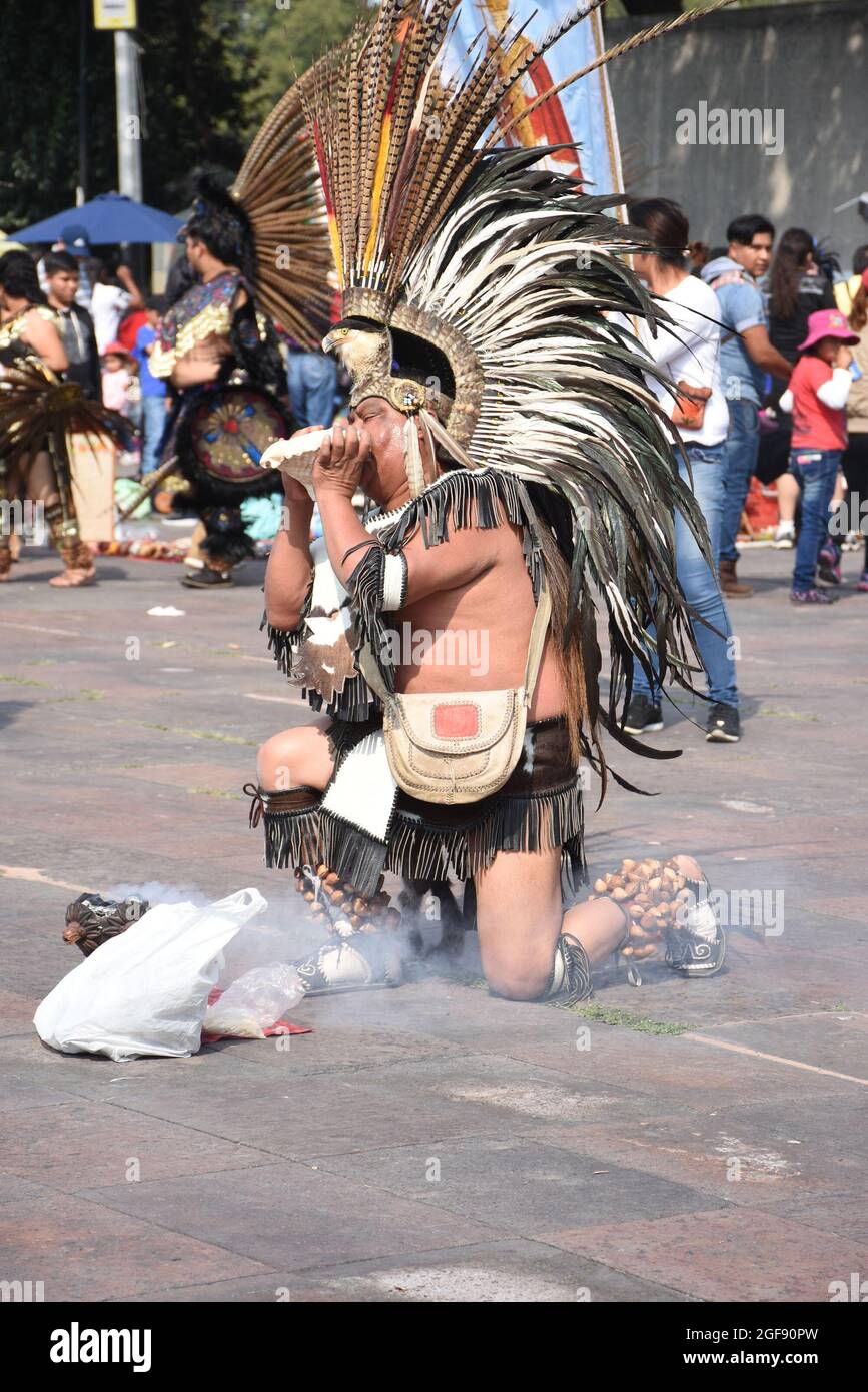 Indigenous people—called Concheros—dressed in traditional clothing for ...