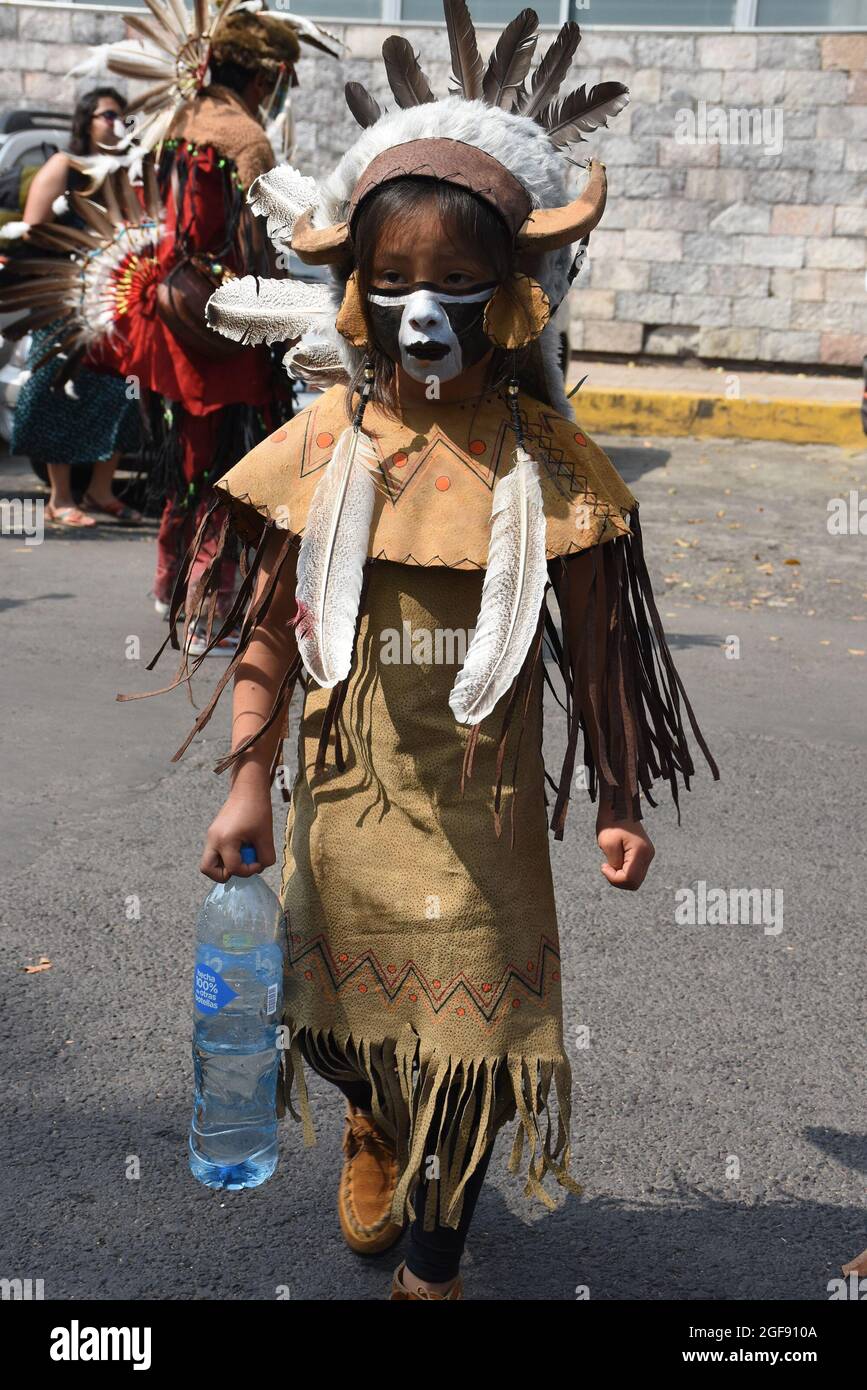 Indigenous people—called Concheros—dressed in traditional clothing for ...