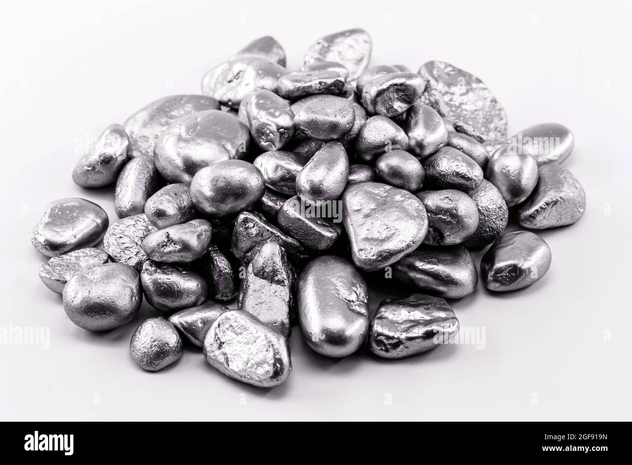 various rough silver nuggets on black background, texture of silvery ...