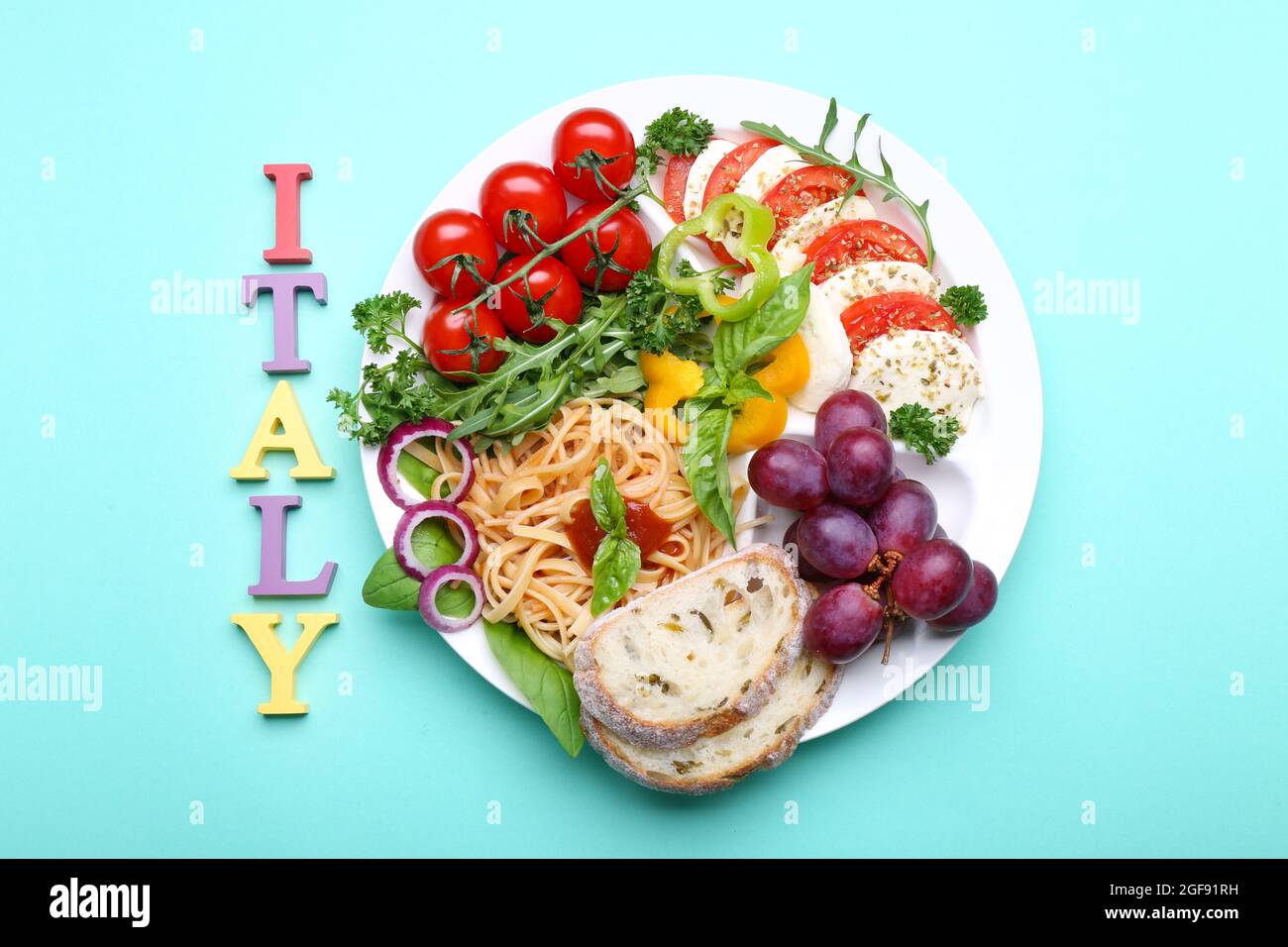Traditional Italian lunch on blue background Stock Photo - Alamy