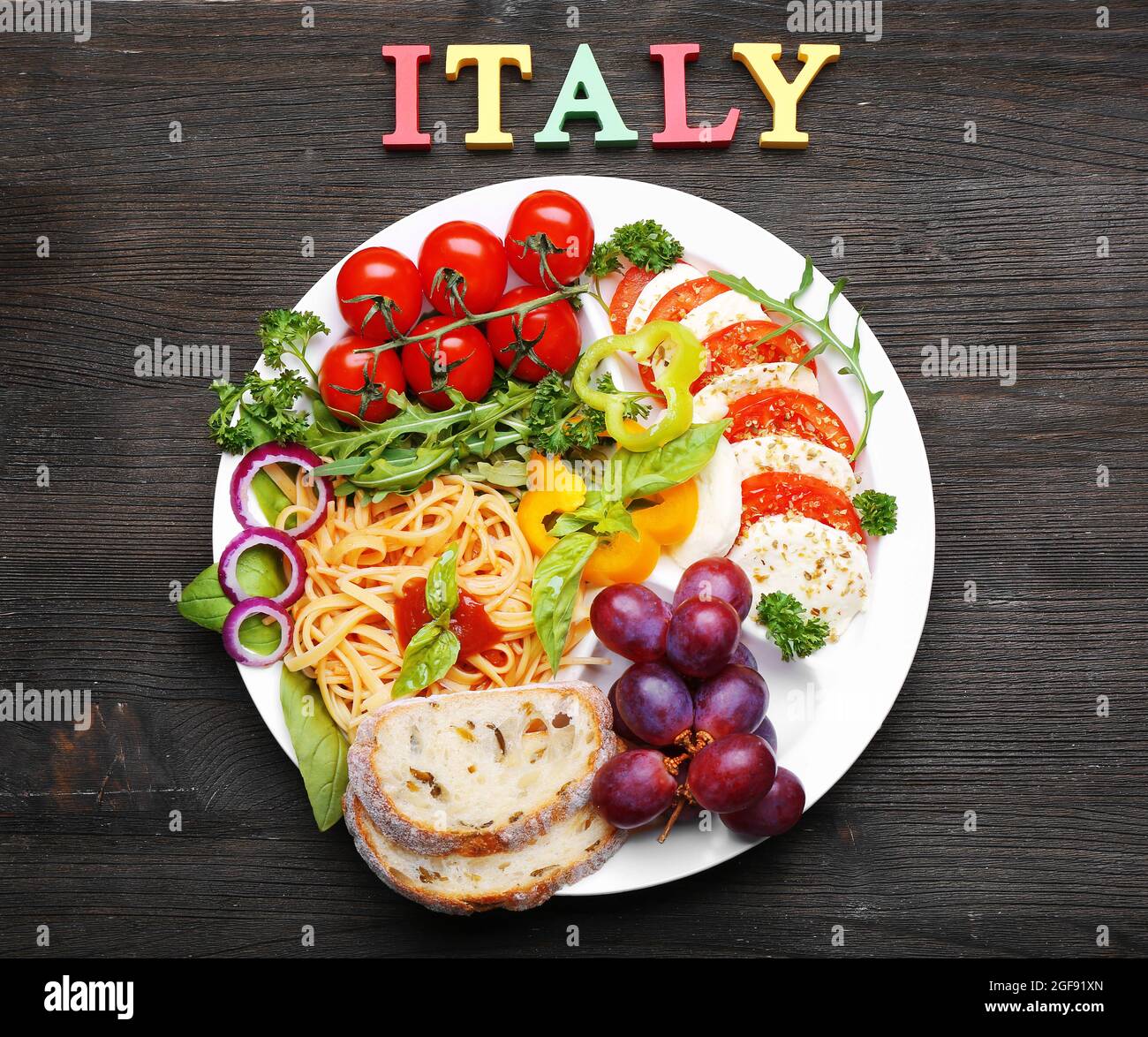 Traditional Italian lunch on wooden background Stock Photo - Alamy