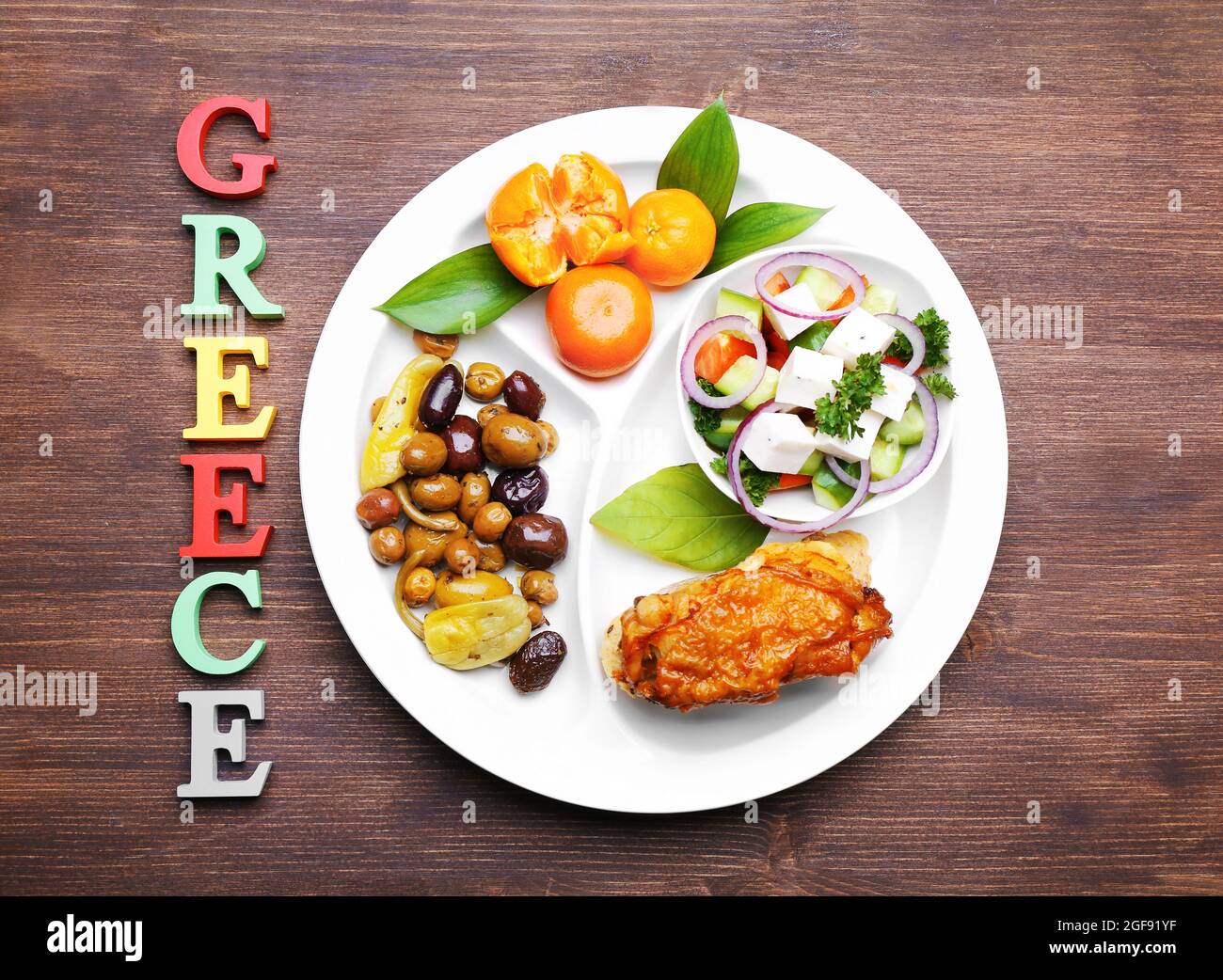 Traditional Greek lunch on wooden background Stock Photo - Alamy