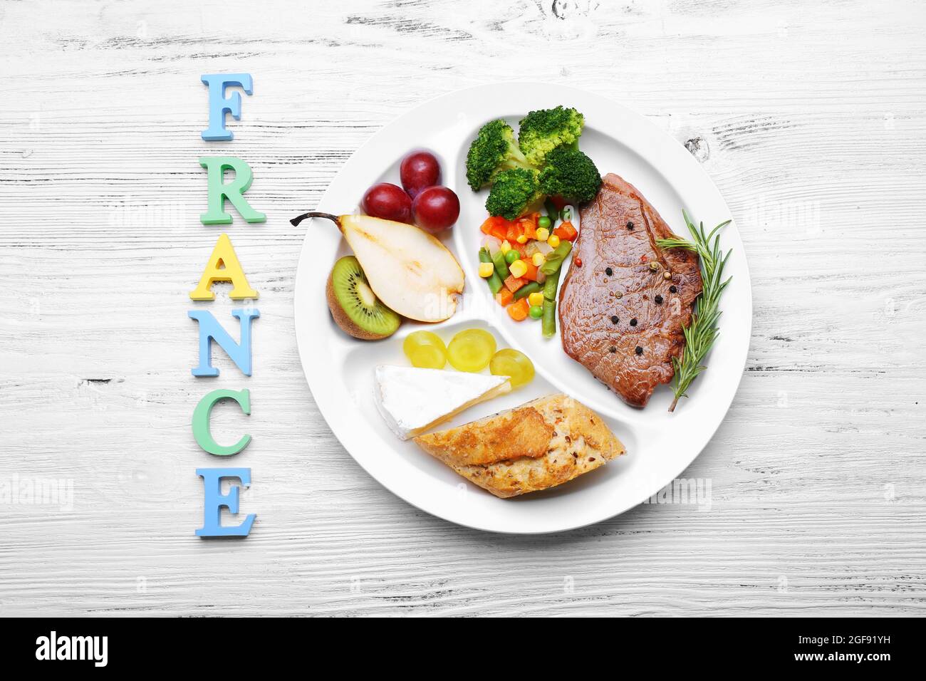 Traditional French lunch on white wooden background Stock Photo - Alamy