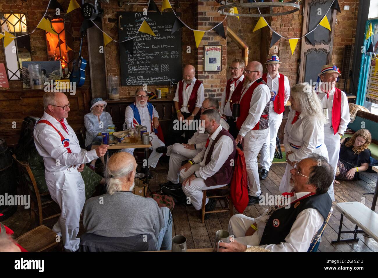A group of morris men singing traditional sea shanties in a restautant ...