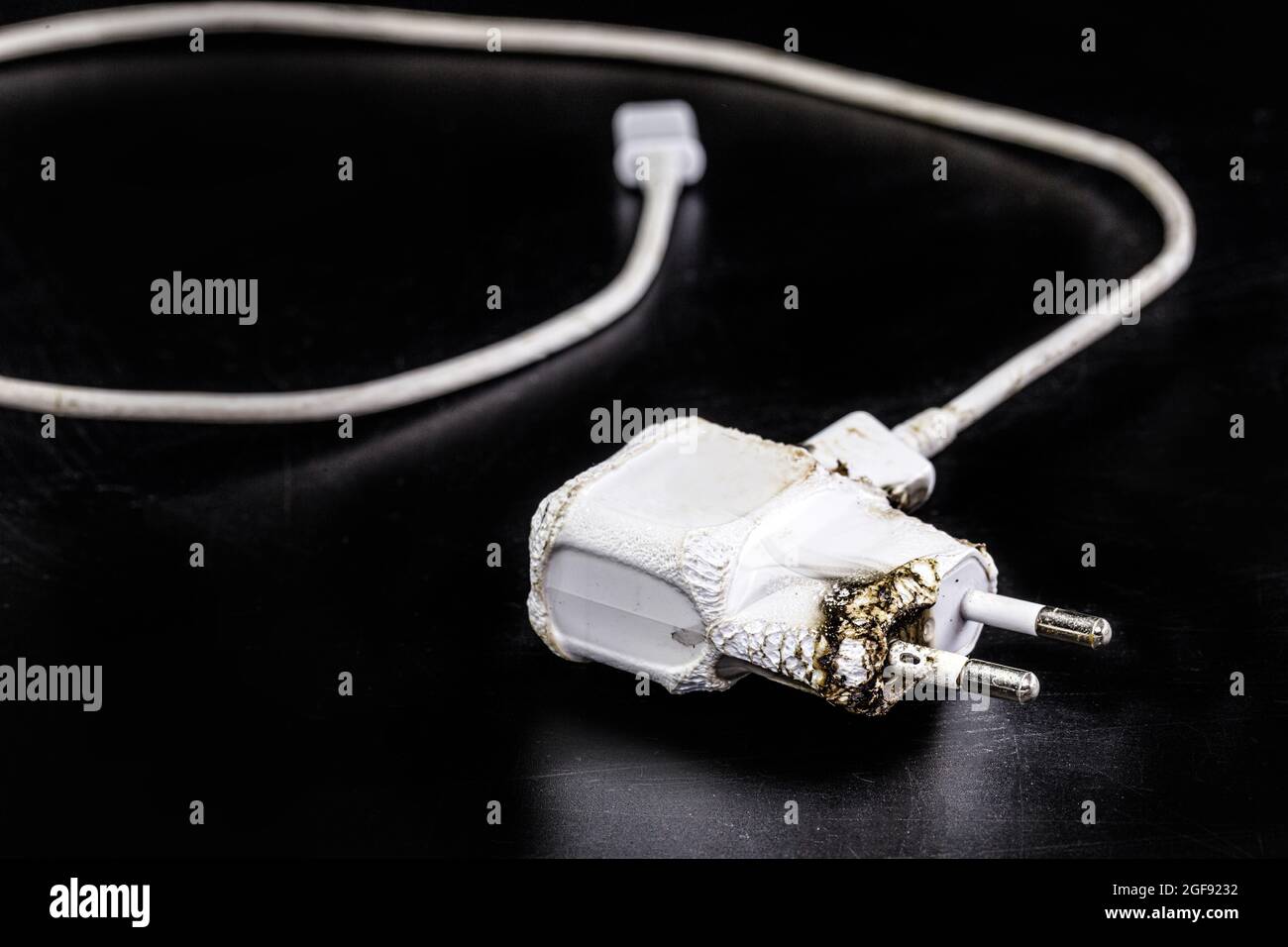 broken smartphone charger, charred after short circuit Stock Photo - Alamy