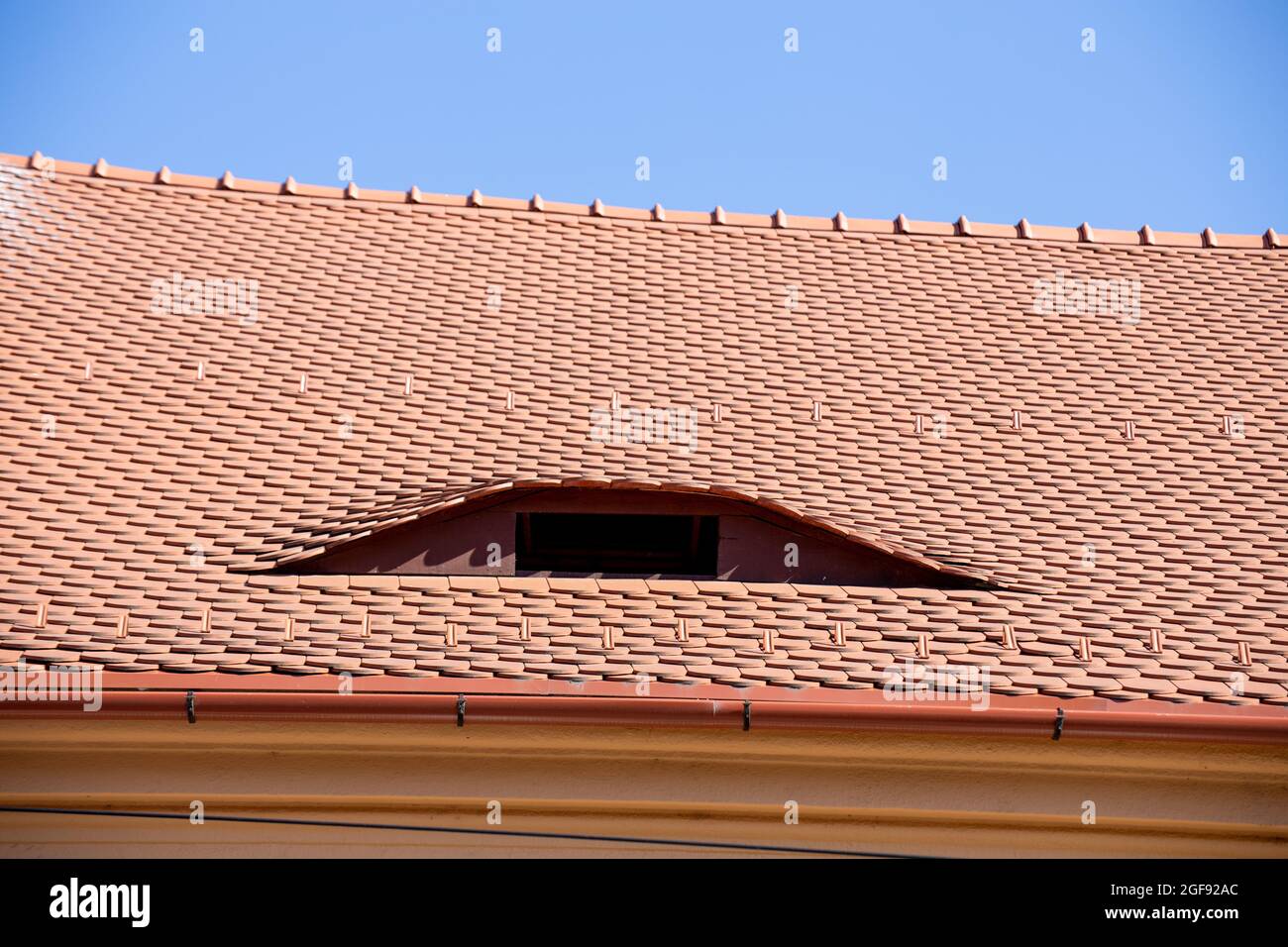 Newly tiled roof in Transylvania, Romania with dormer windows typical ...