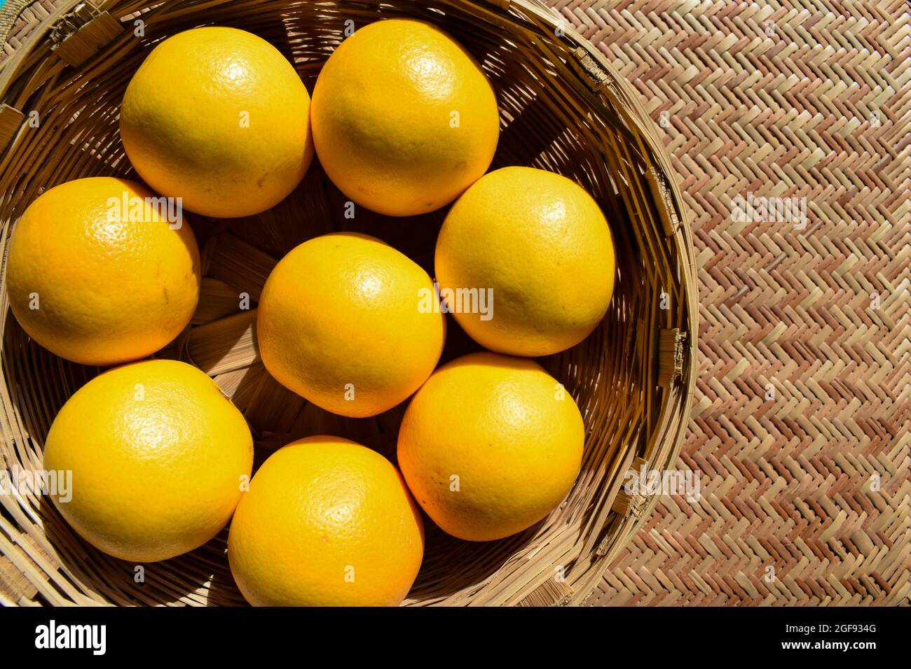 Farm fresh heaps of Citrus fruits Maltas in wicker basket. Organic ...