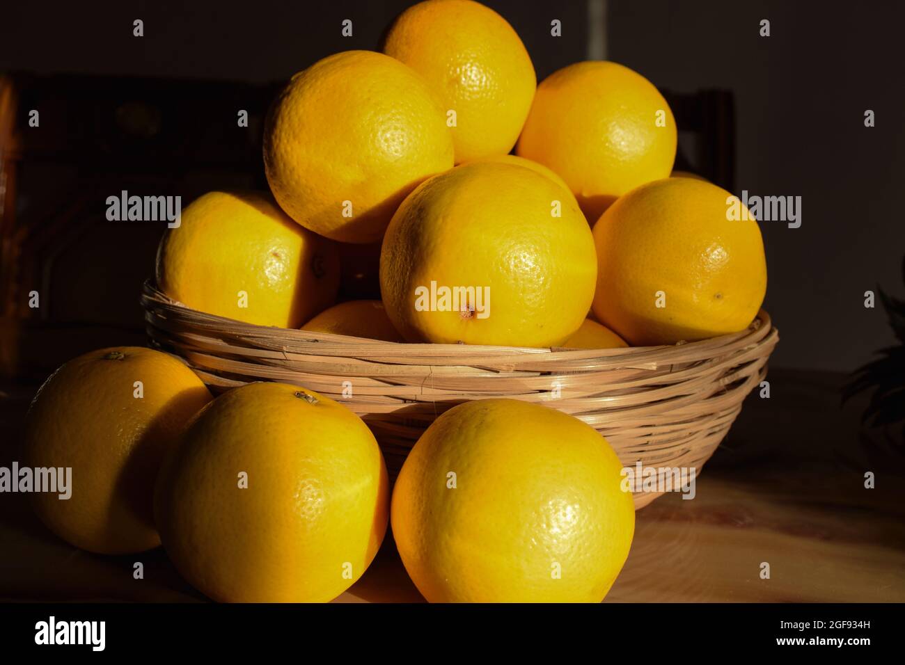 Farm fresh heaps of Citrus fruits Maltas in wicker basket. Organic ...