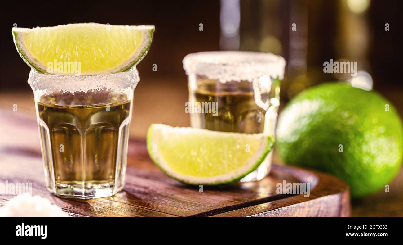Distilled drink with salt and lemon. Glass of tequila, typical mexican ...