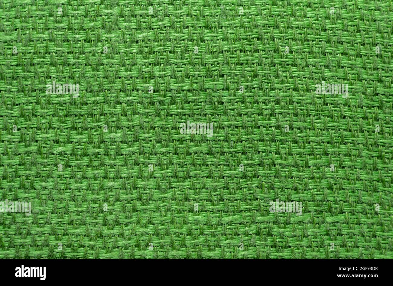 Textile. The texture is green with straight lines and weave. Close-up ...