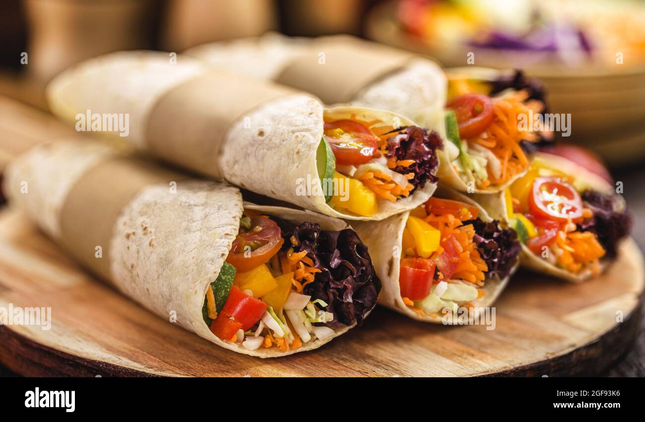 vegan wrap, made with flat bread and various vegetables, healthy fast ...