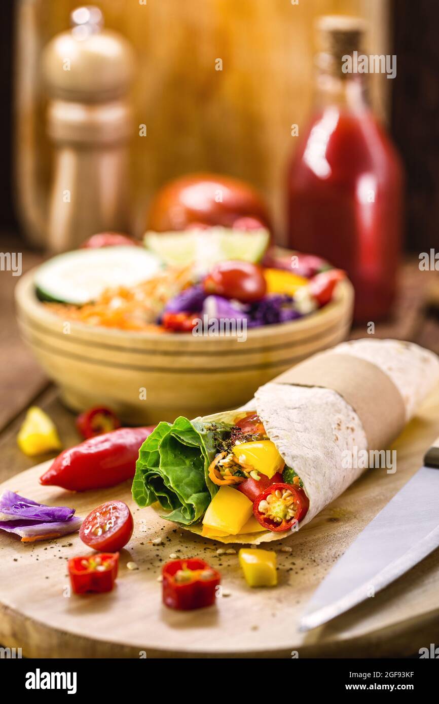 vegan wrap, made with flat bread and various vegetables, healthy fast ...