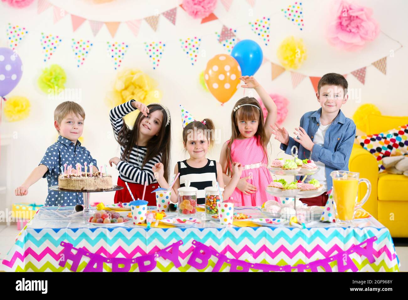 Happy group of children dancing at birthday party Stock Photo - Alamy