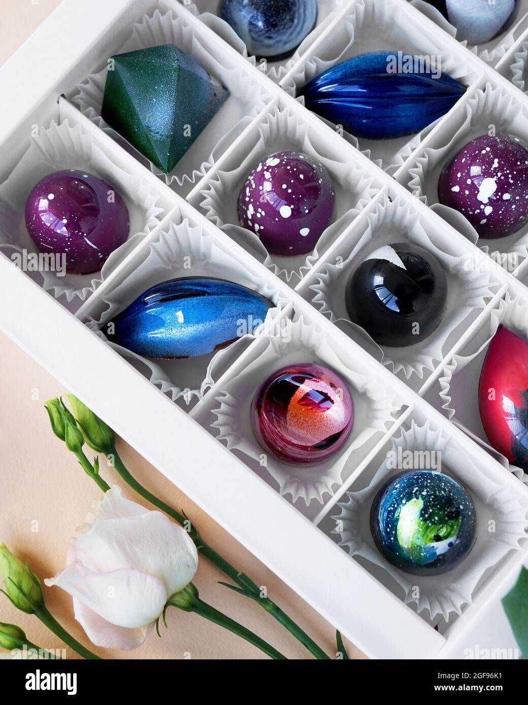 Gift box of handmade chocolates. Geometric and space design. Box on a ...