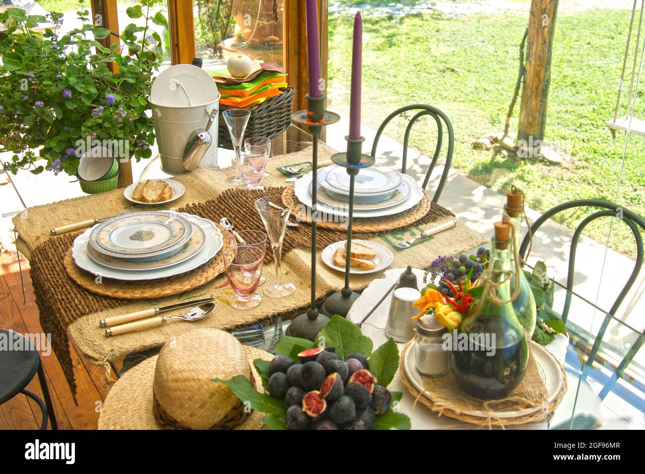 Dining table set for two people overlooking the garden in summ Stock ...