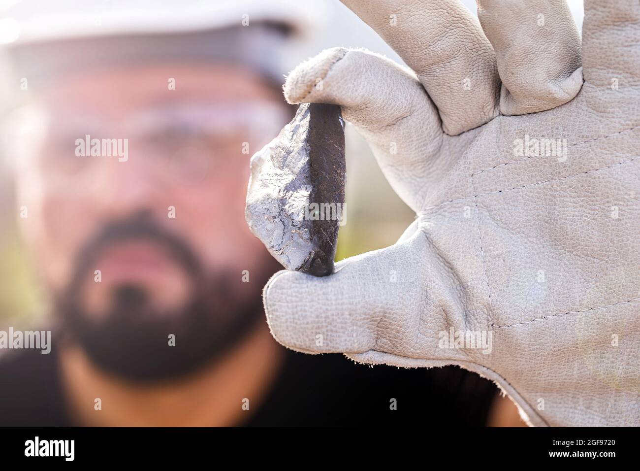 rough ore stone, palladium nugget. Concept of metal mining used in the ...
