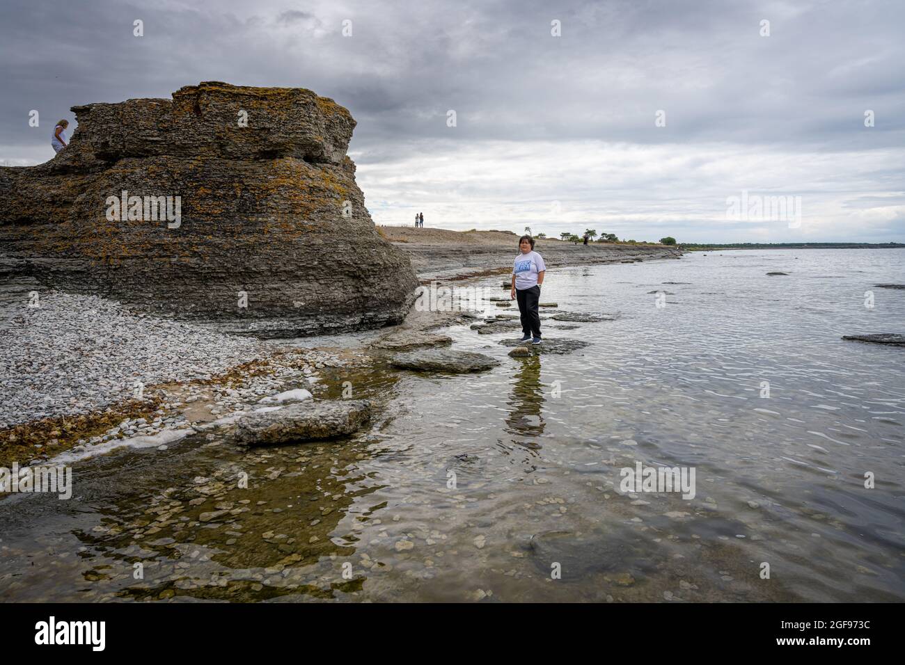 A beautiful limestone formation with a dramatic sky in the background ...