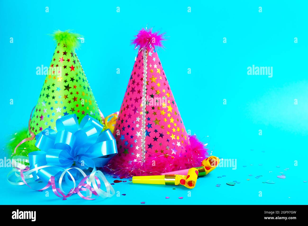 Funny party hats on blue background Stock Photo - Alamy