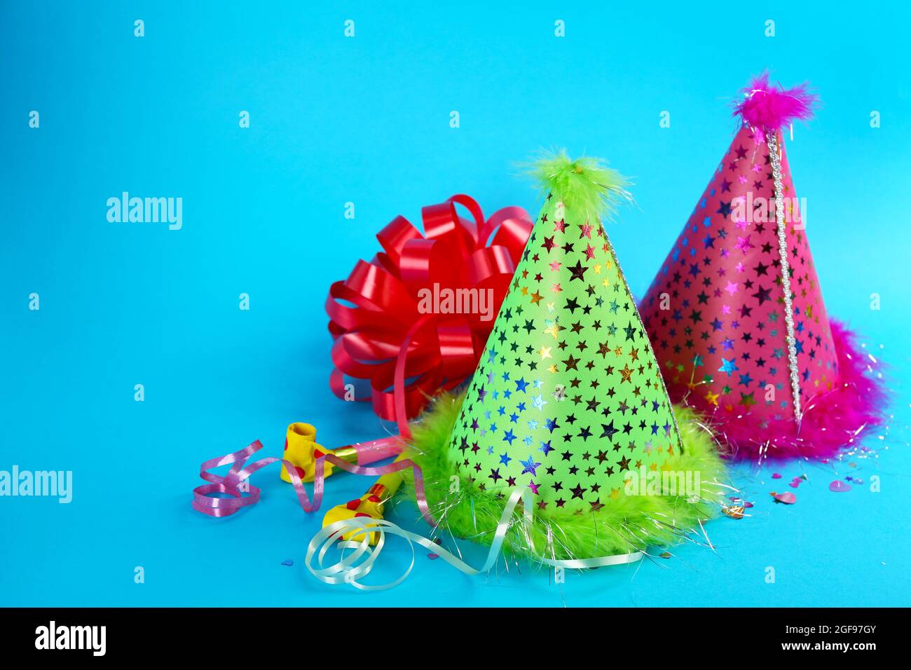 Funny party hats on blue background Stock Photo - Alamy
