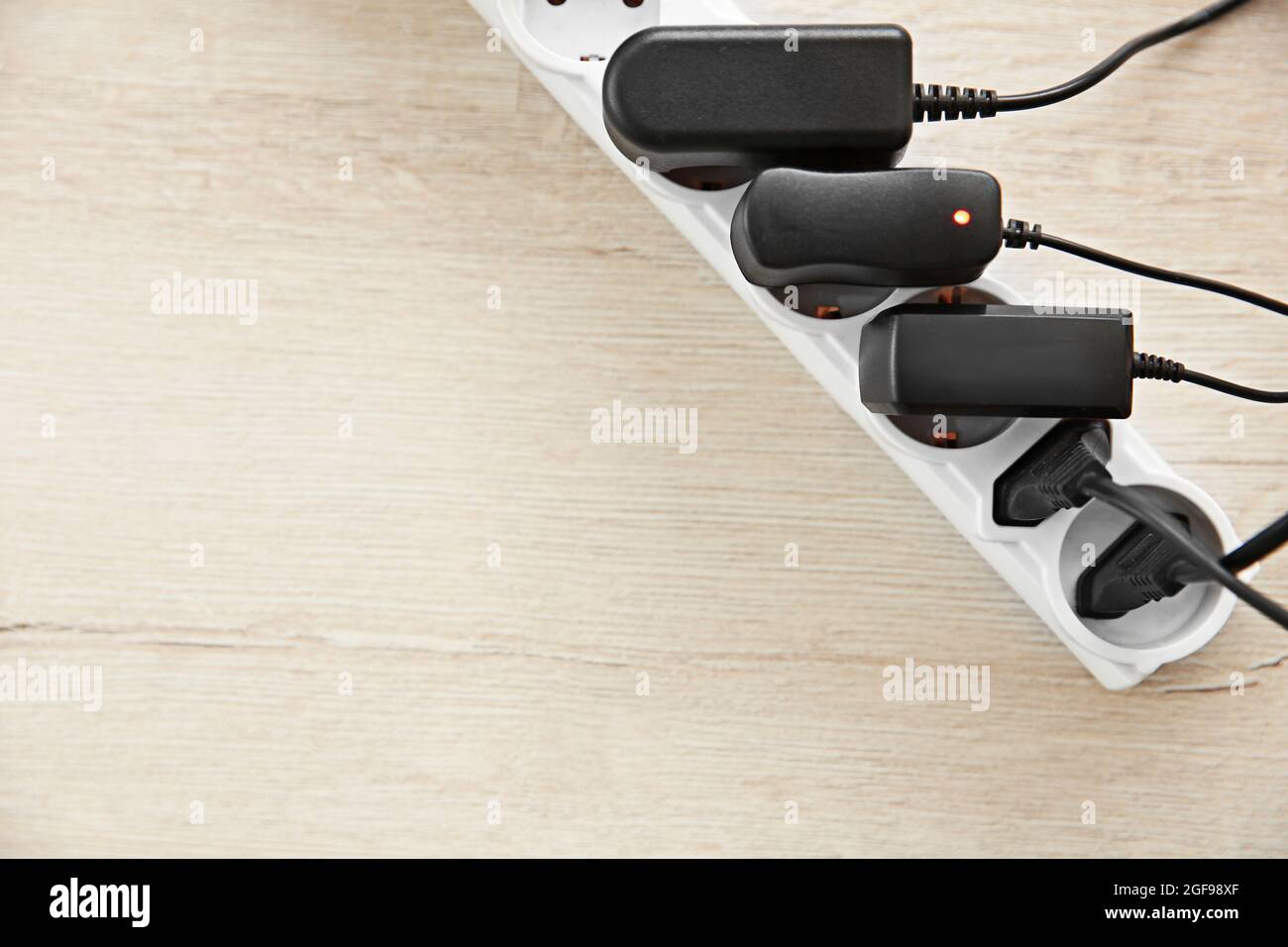 Loaded power strip Stock Photo - Alamy