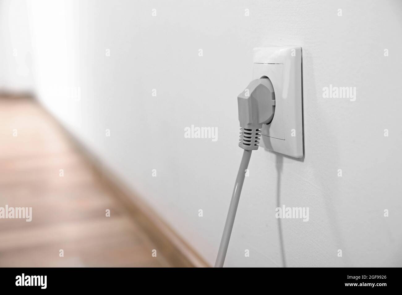 Electric plug in socket Stock Photo - Alamy
