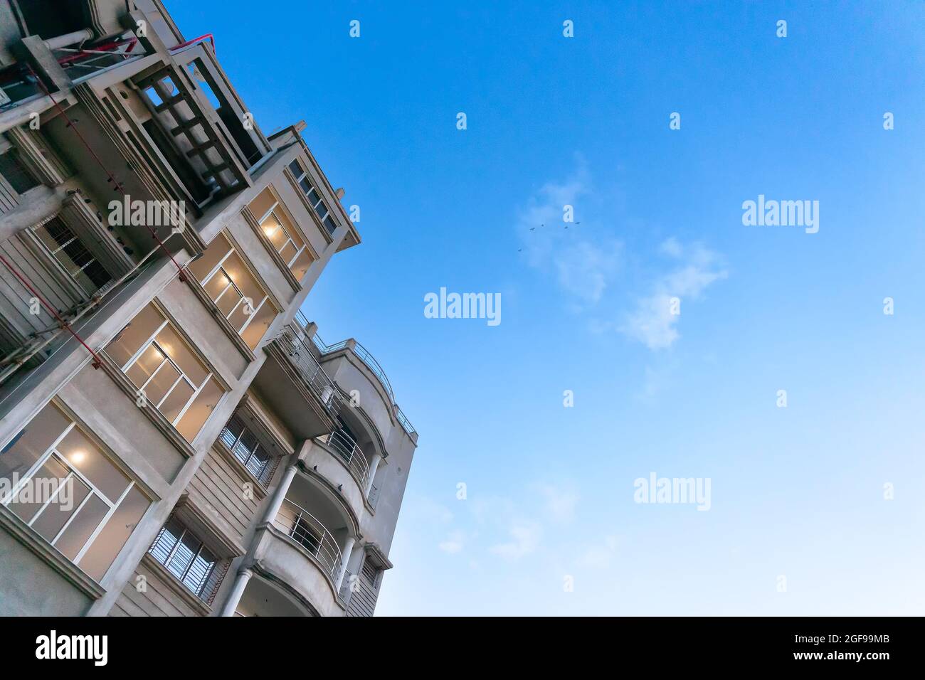 Howrah, West Bengal, India - 28th July 2019 : High rise building in blue hour, blue sky and ...