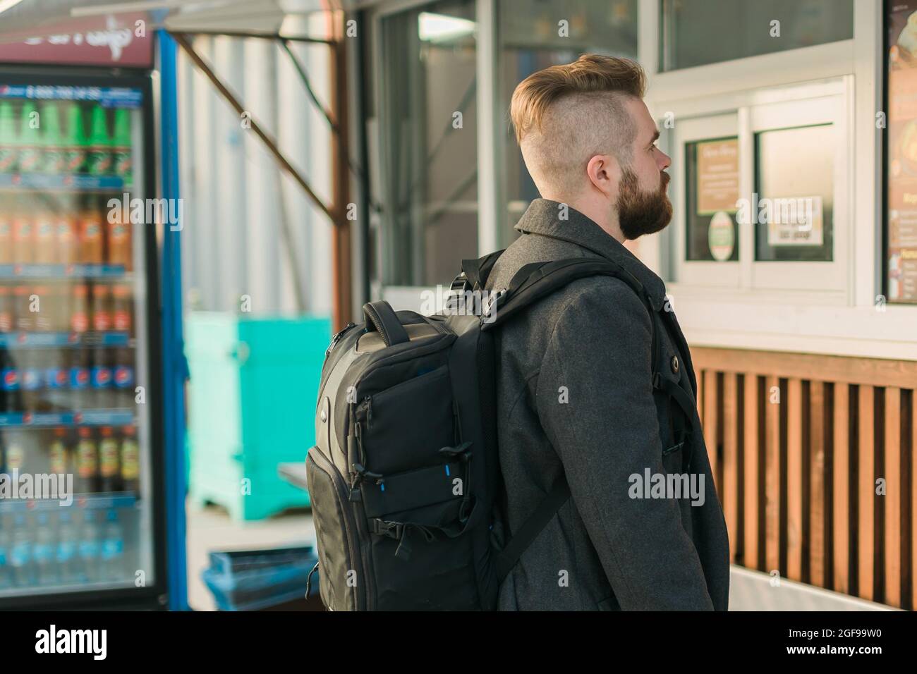 Portrait of man choosing fast food in food truck in the street. Meal ...