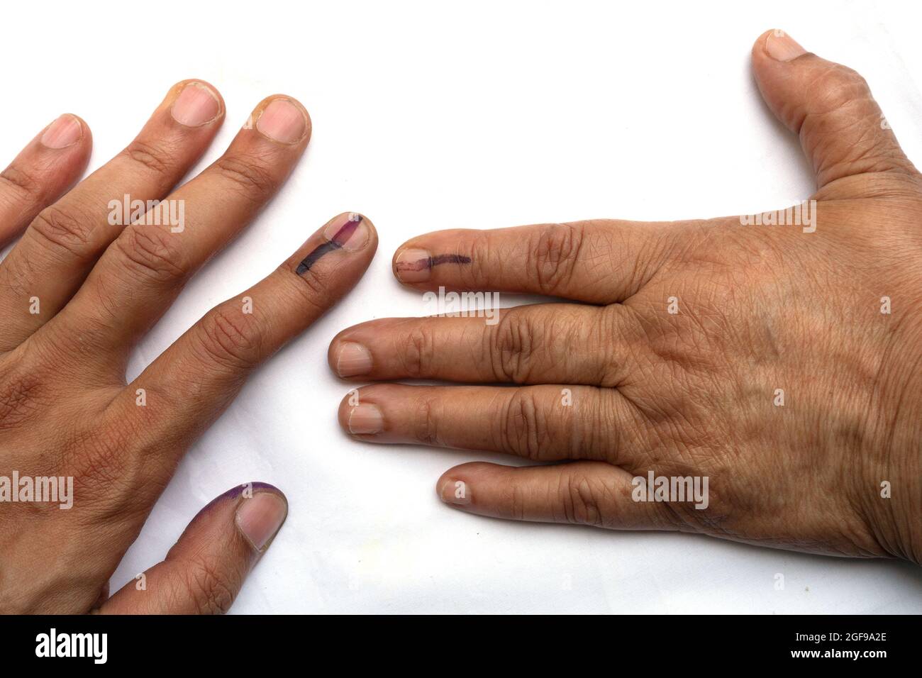 Young man and senior citizen Indian woman voted , exercized voting ...