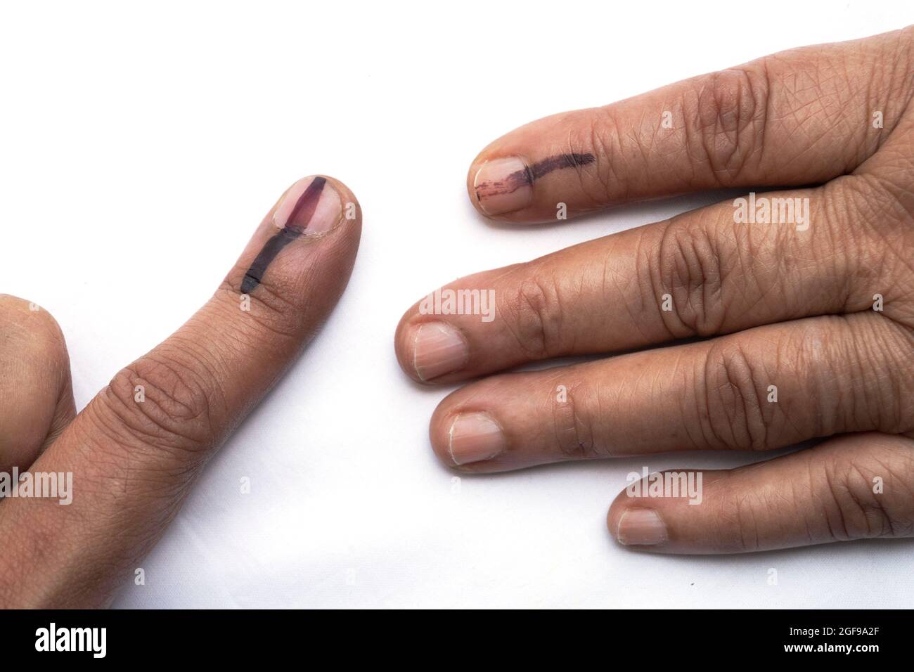 Young man and senior citizen Indian woman voted , exercized voting ...