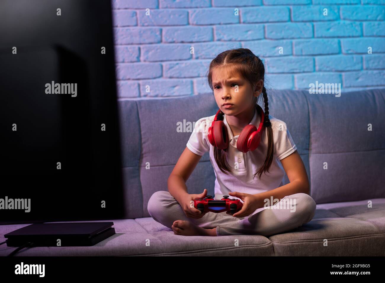 children playing video game with game console Stock Photo - Alamy